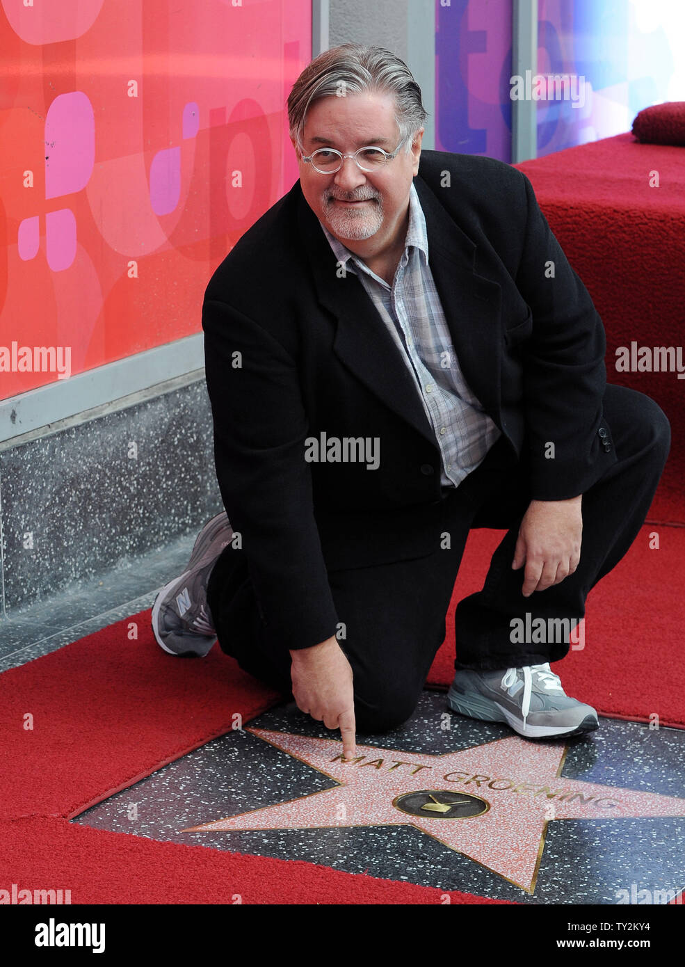 Matt Groening (C), the creator of the longest-running scripted show in ...