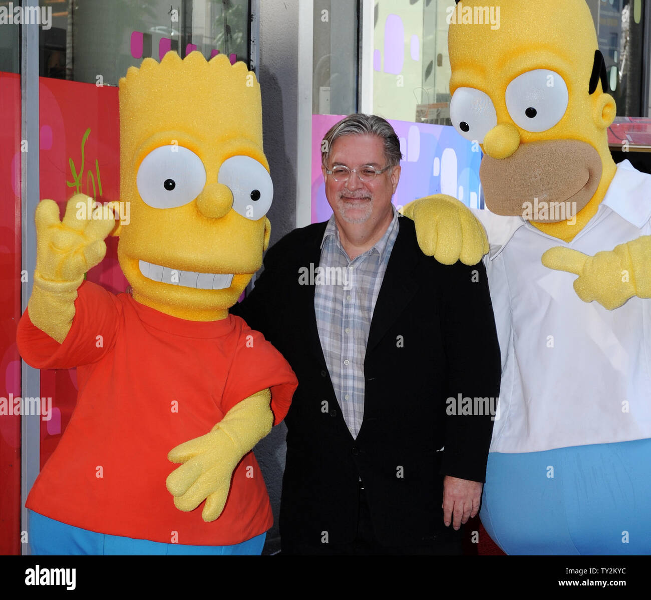 Matt Groening (C), the creator of the longest-running scripted show in ...