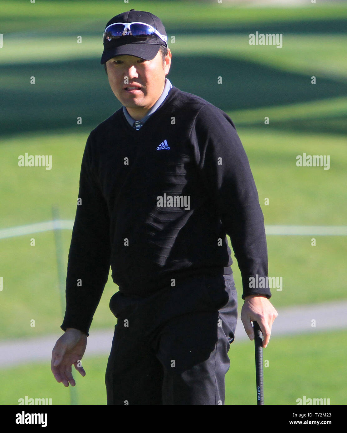 Charlie Wi awaits his turn during the first day of play at the Northern ...