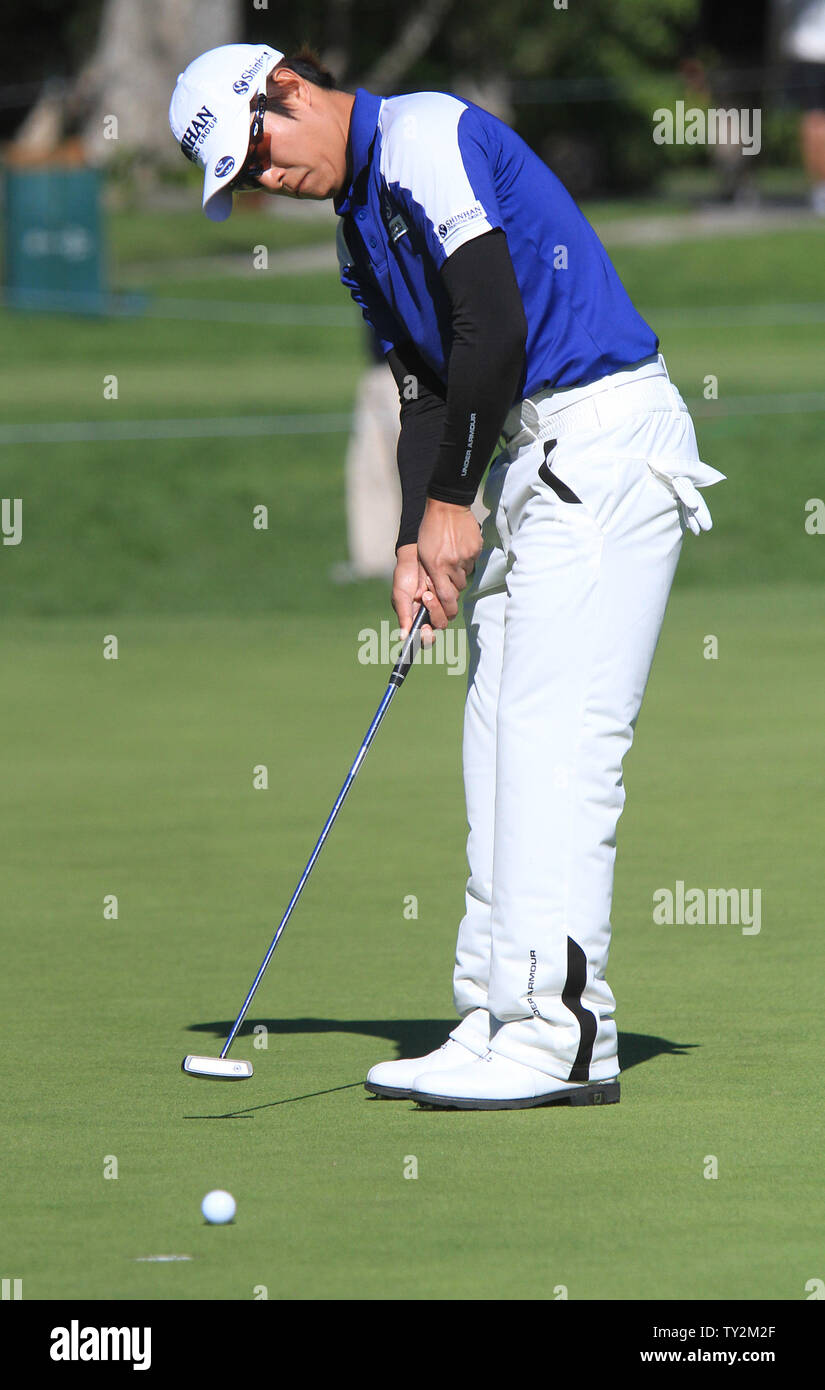 Kyung-tae Kim hits a putt during the first day of play at the Northern ...