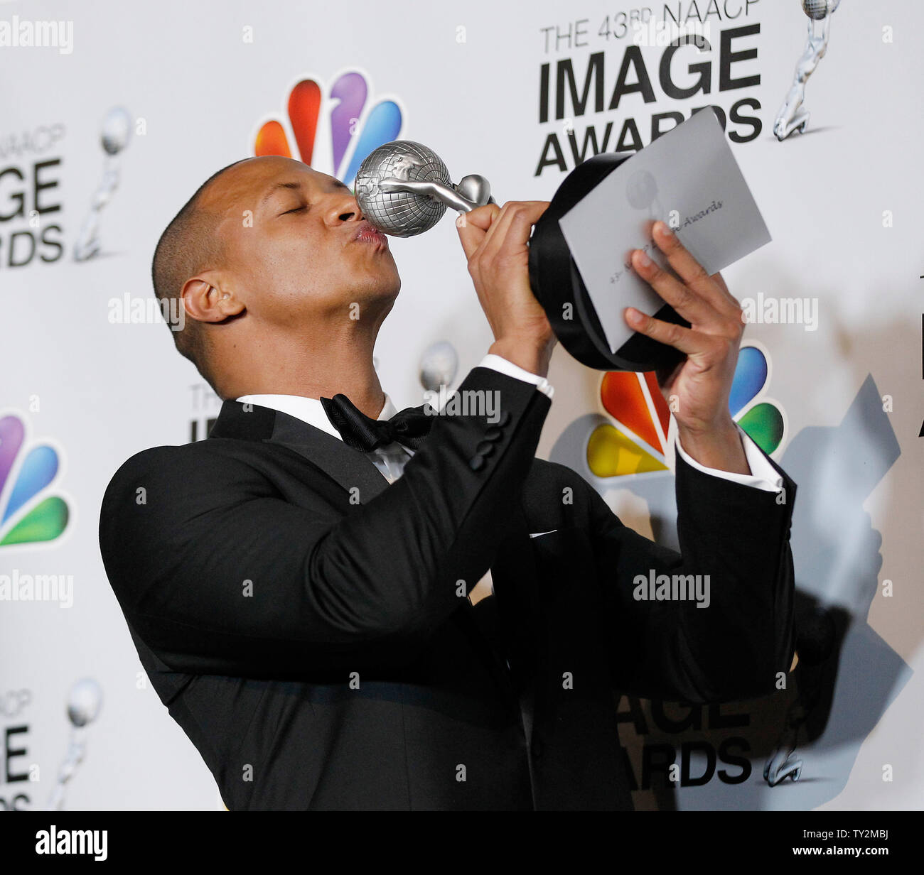 Actor Emerson Brooks holds his award for Outstanding Actor in a Daytime ...