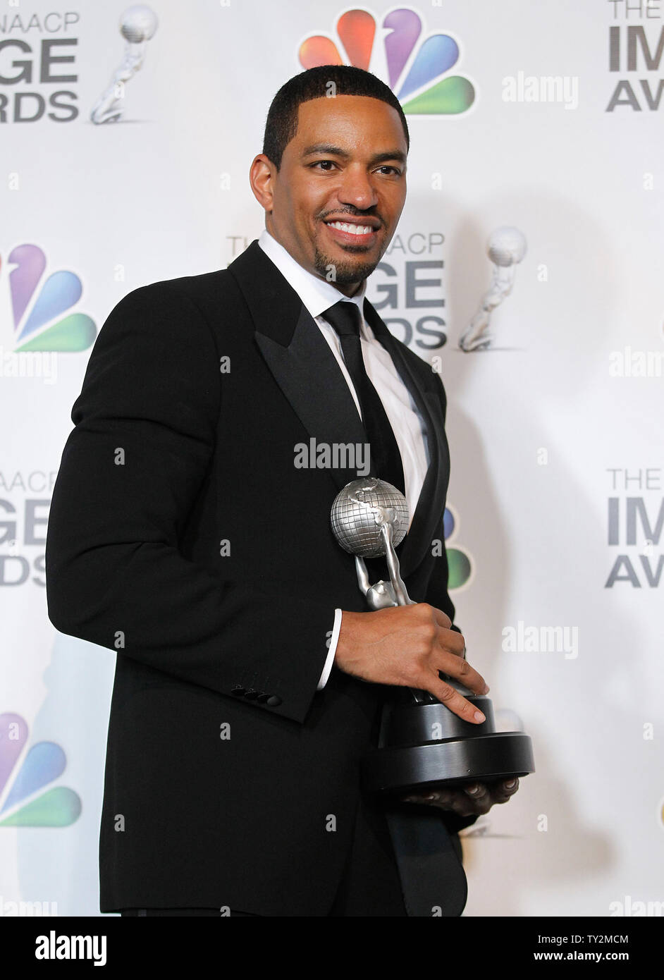 Actor Laz Alonzo holds his award for Outstanding Actor in a Motion ...