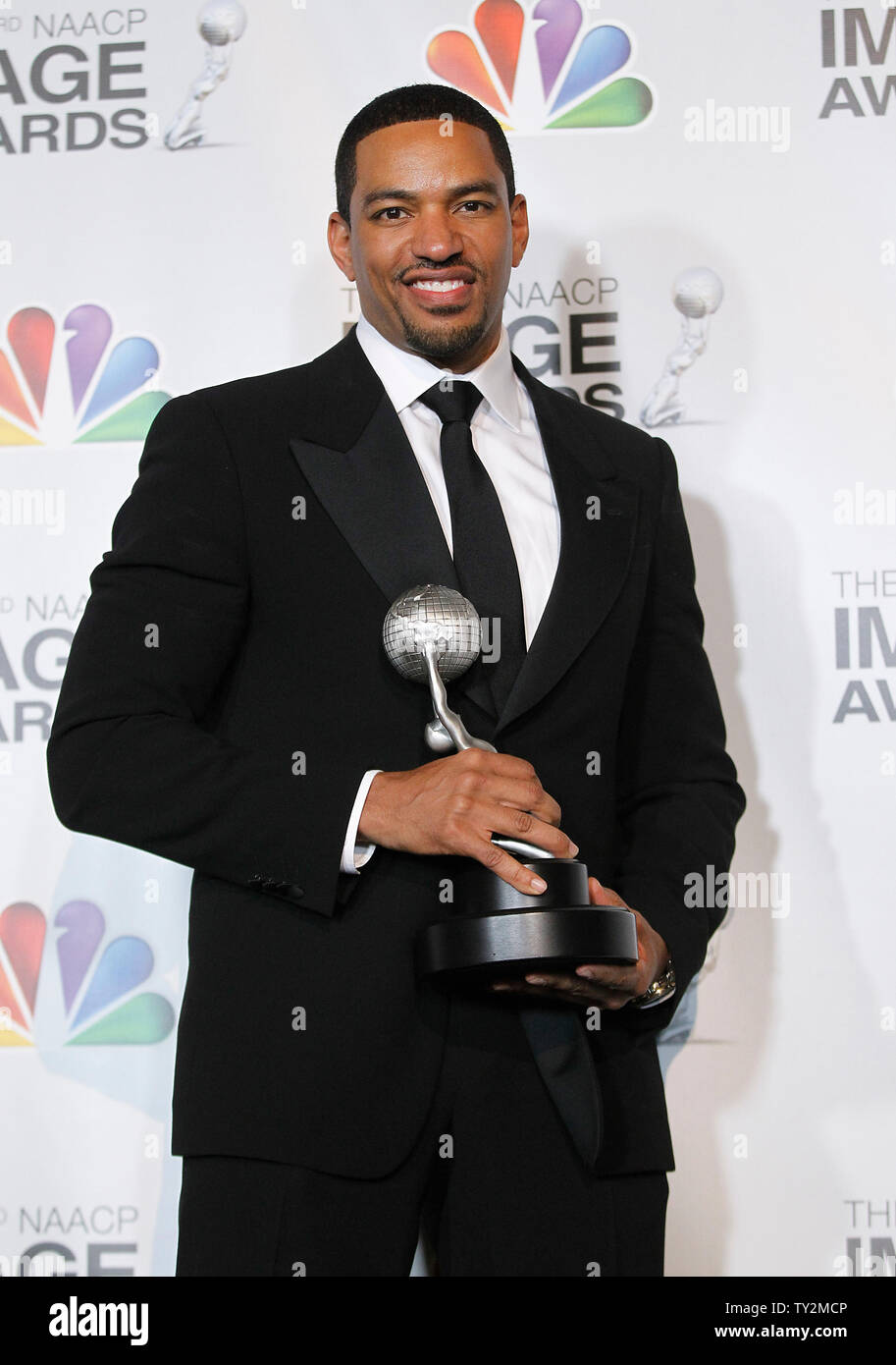 Actor Laz Alonzo holds his award for Outstanding Actor in a Motion ...