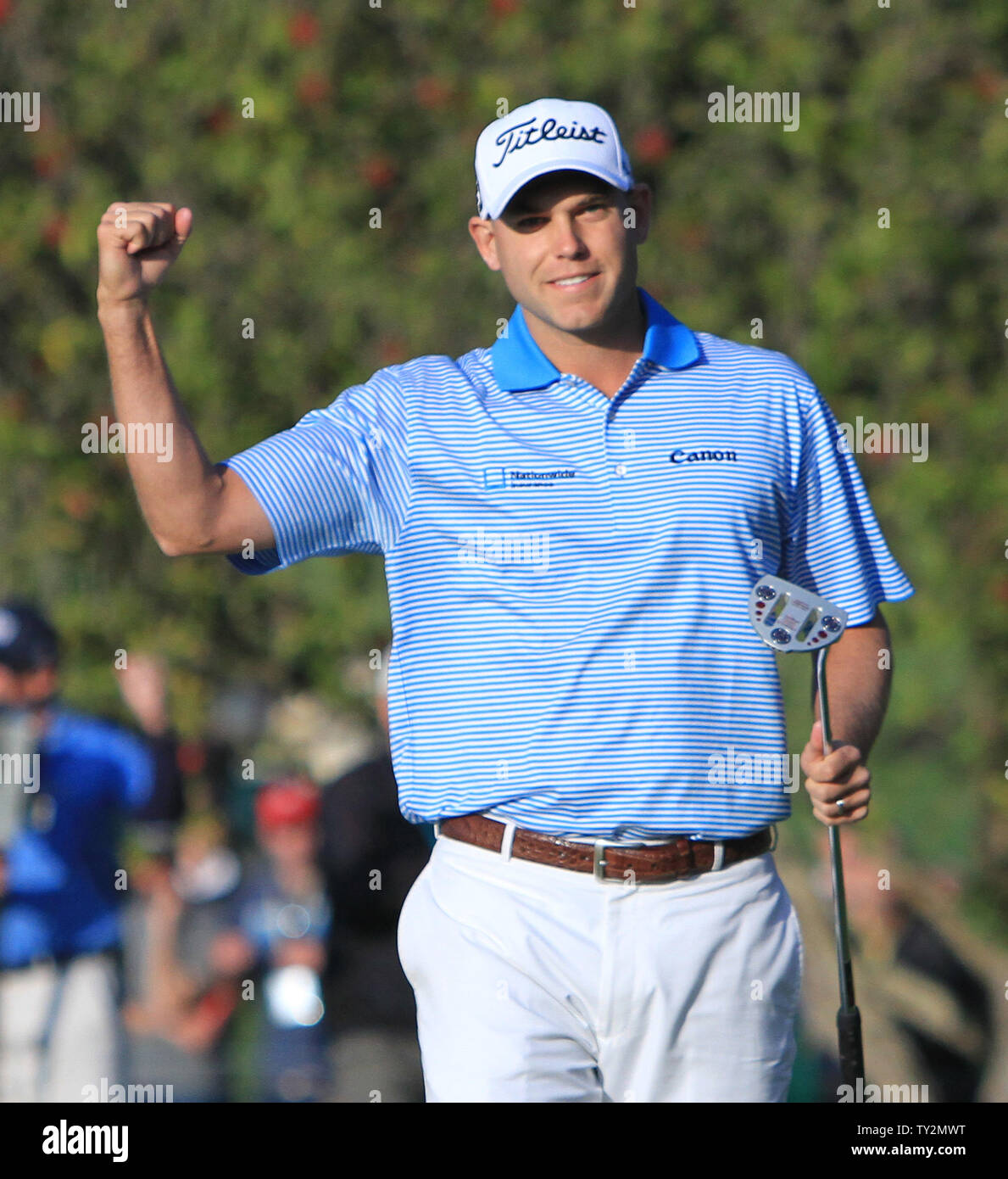 Bill Haas celebrates after making a long putt at the second extra hole ...