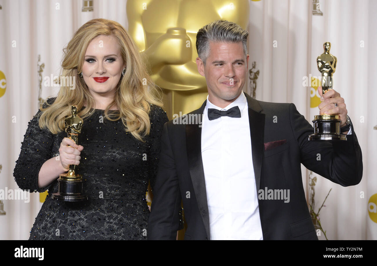Adele Adkins and Paul Eqworth pose with their Oscars for Achievement in Music (Original Song ...