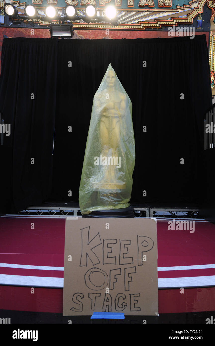 An Oscar statue is covered with plastic as preparations are underway ...