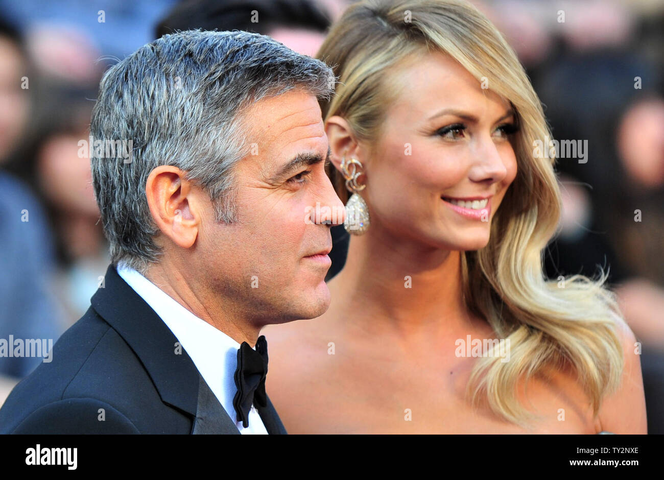 George Clooney and Stacy Keibler arrive on the red carpet at the 84th ...