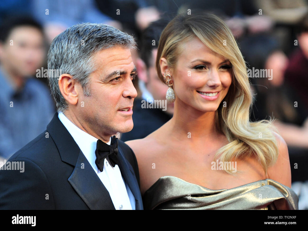 George Clooney and Stacy Keibler arrive on the red carpet at the 84th ...