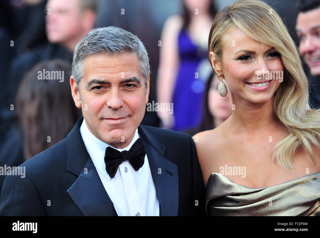 George Clooney and Stacy Keibler arrive on the red carpet at the 84th ...