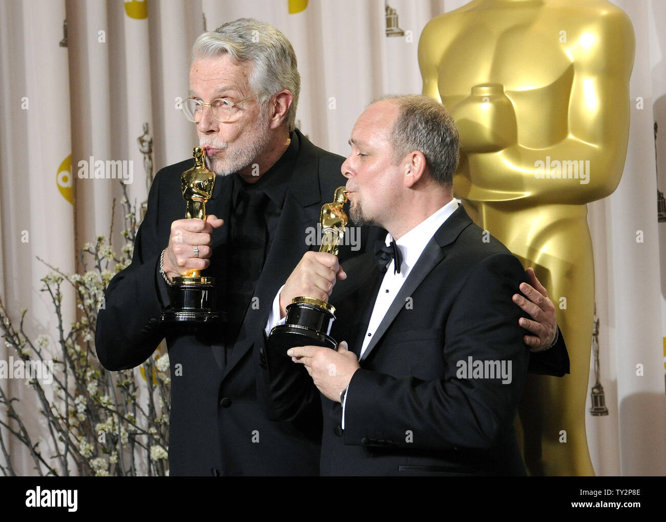 Mark Coulier and J. Roy Helland hold their Oscars for Achievement in ...