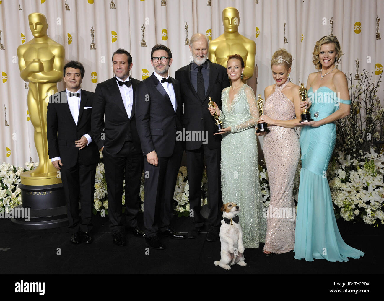 The cast of "The Artist" pose backstage at the 84th Academy Awards in ...