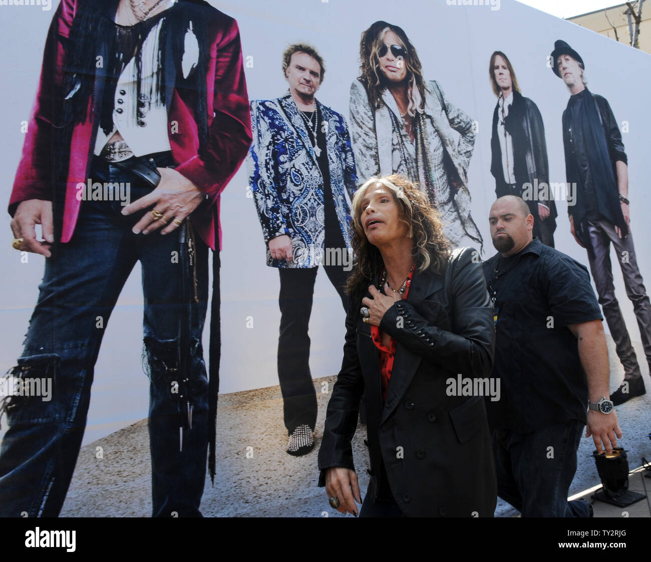 Steve Tyler, lead singer in the rock band Aerosmith arrives to announce ...