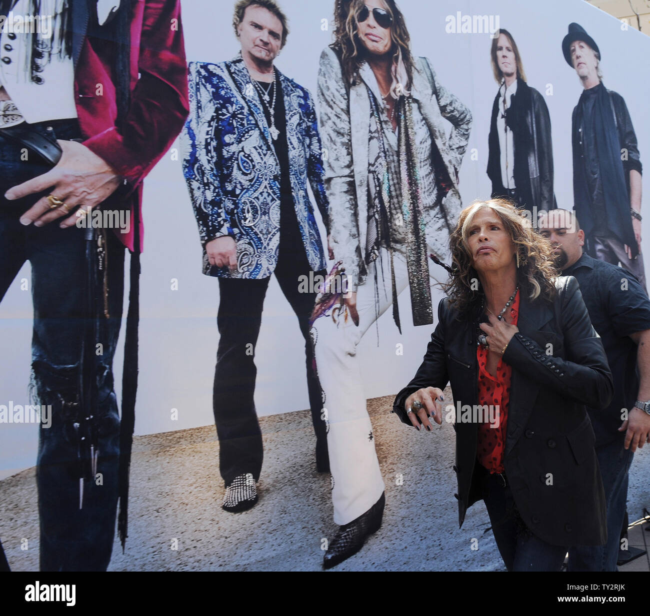 Steve Tyler, lead singer in the rock band Aerosmith arrives to announce ...