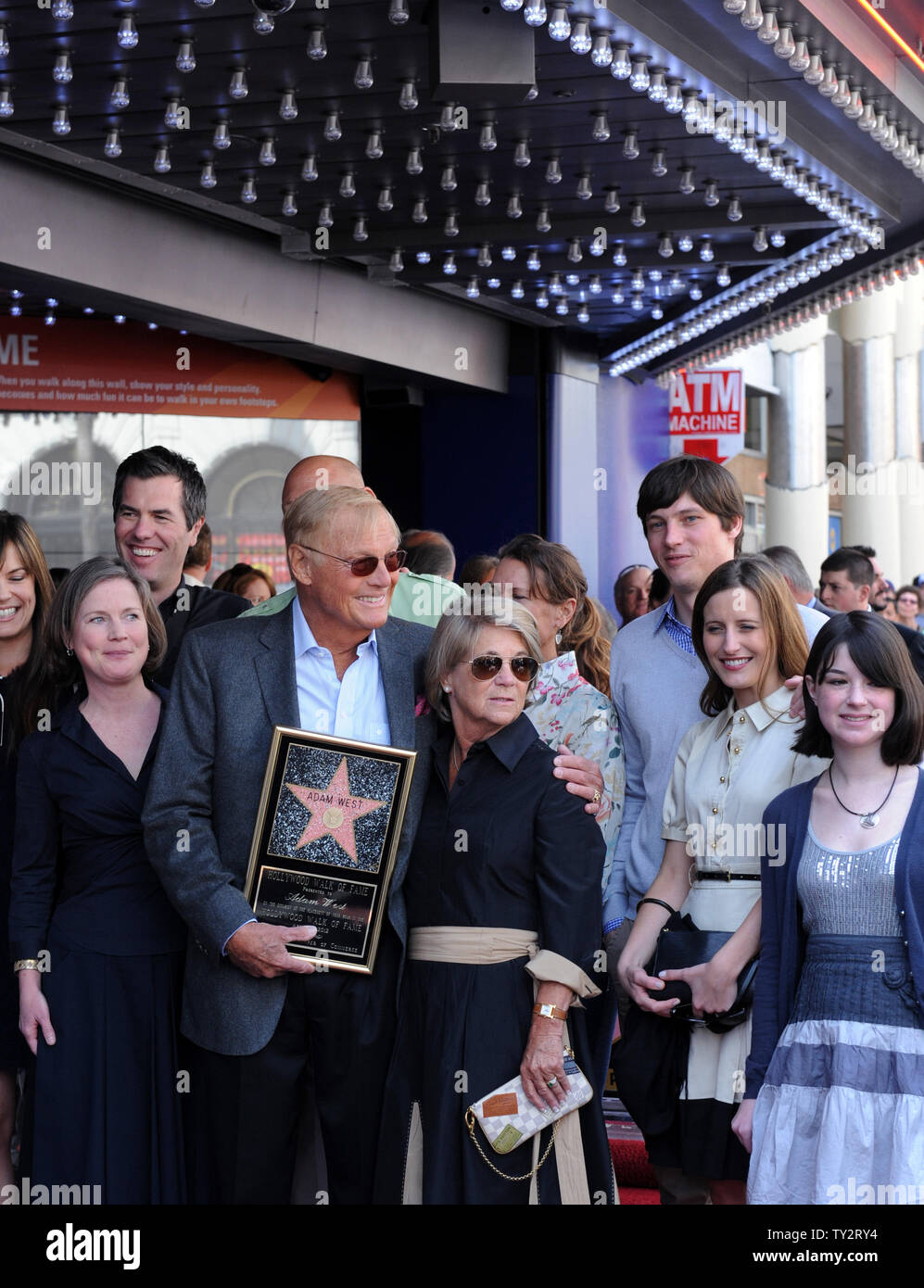 Actor Adam West hugs his wife Marcelle Lear surrounded by family ...
