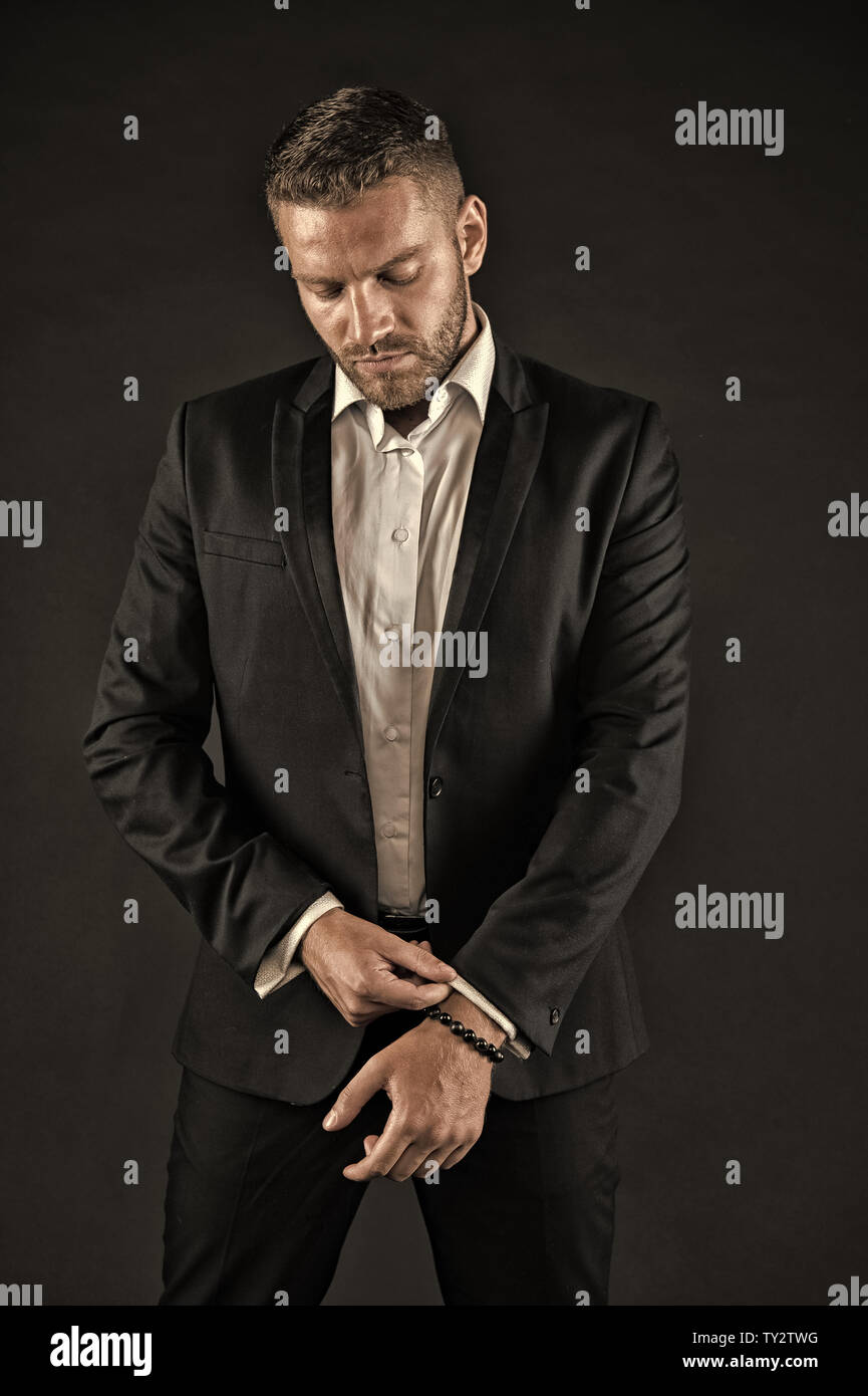 Man in formal outfit on black background. Manager with beard on ...