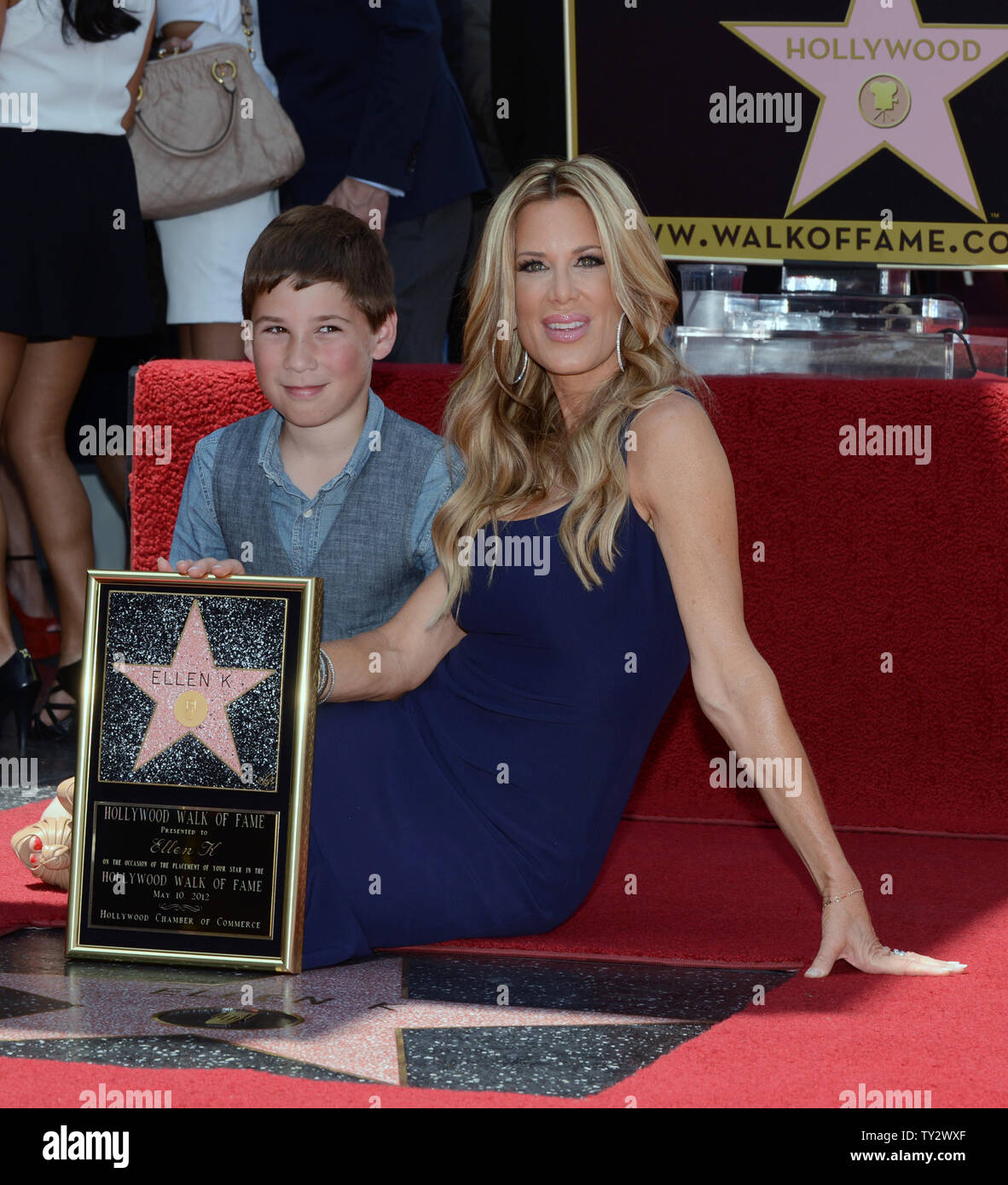 Radio personality Ellen K holds a replica plaque during an unveiling ...