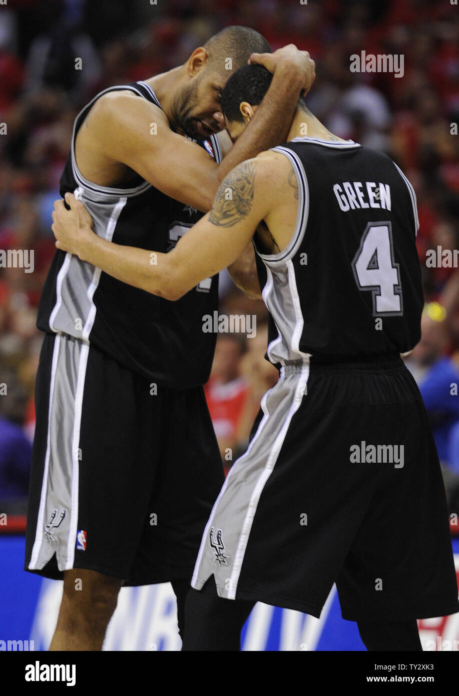 San Antonio Spurs center Tim Duncan (21) and Daniel Green (4) hug after ...