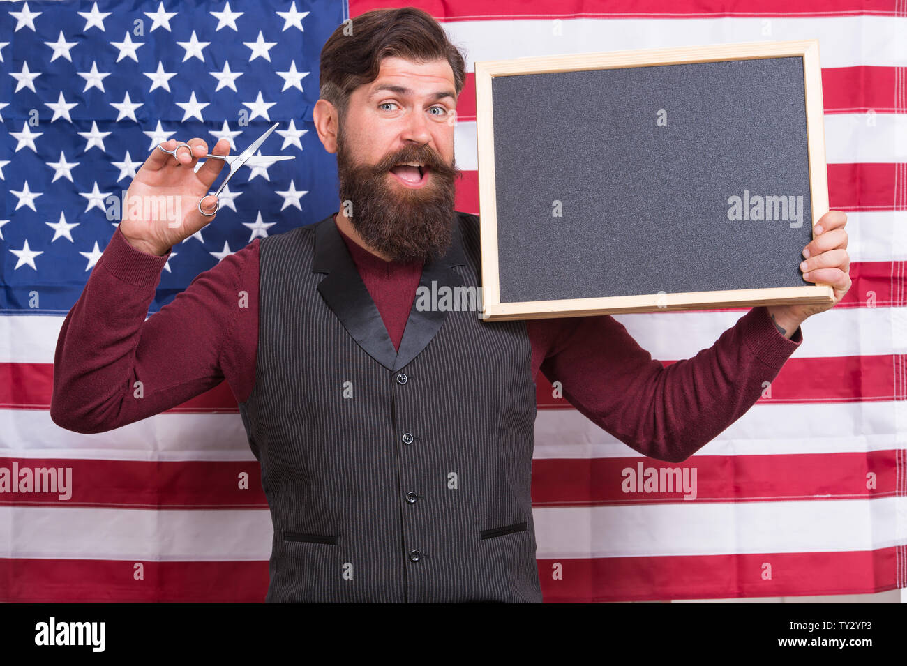 Becoming a master barber. Barber teaching barbering on american flag ...