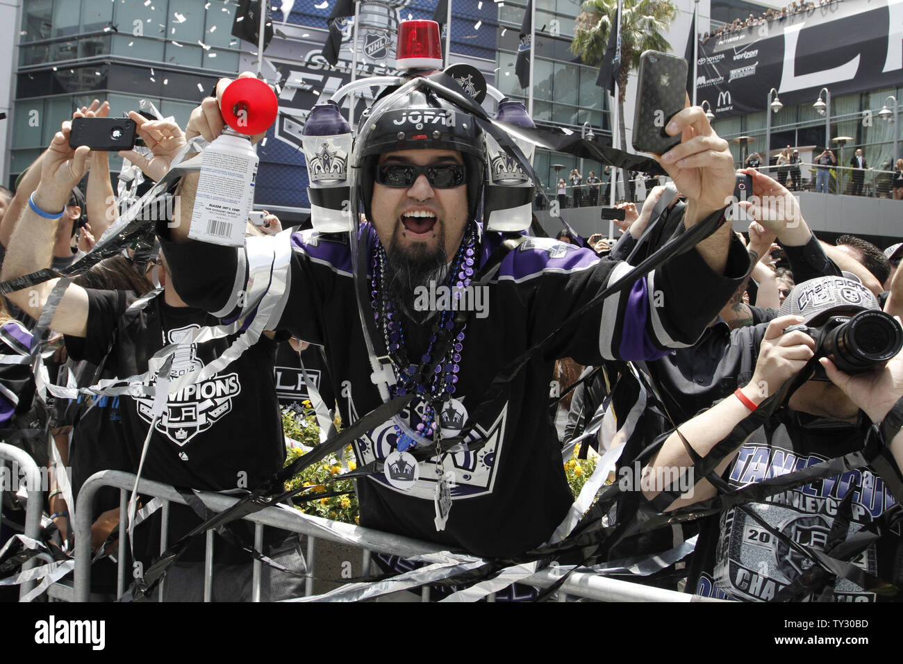 Los Angeles Kings fans celebrate along the parade route during a parade ...