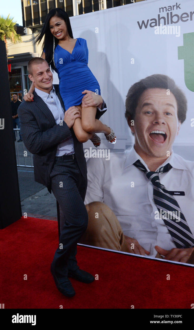 New England Patriots' tight end Rob Gronkowski holds up actress Chanty ...