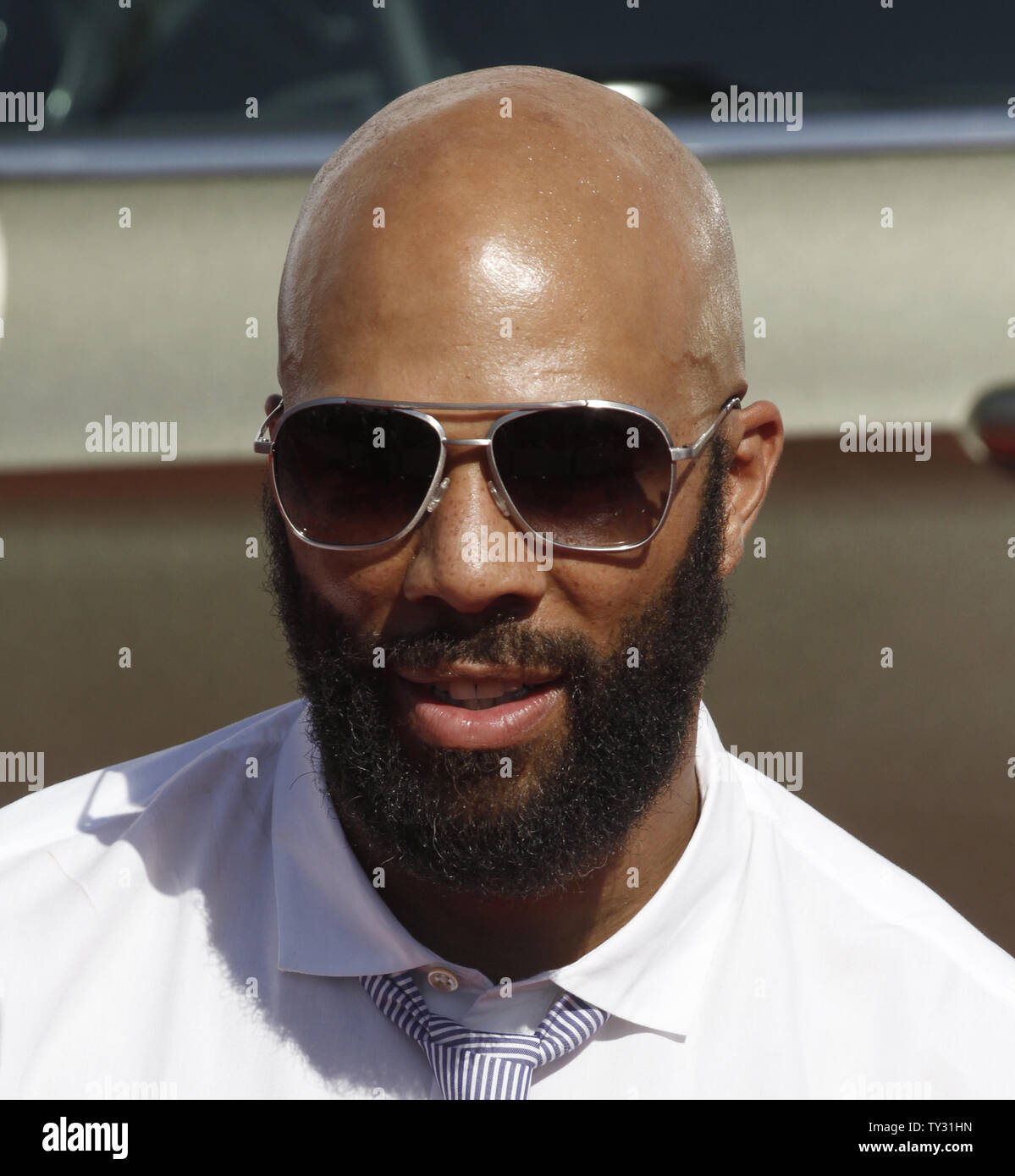 Hip-hop artist Commo arrives for the BET Awards 12 at the Shrine ...