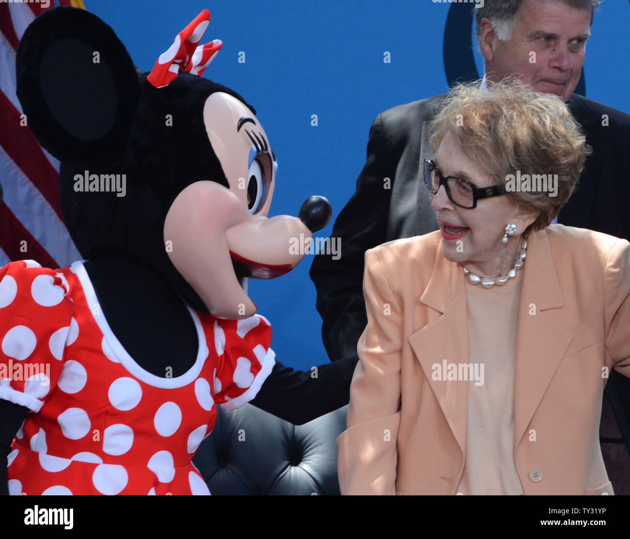Former first lady Nancy Reagan (R) shares a moment with Minnie Mouse ...
