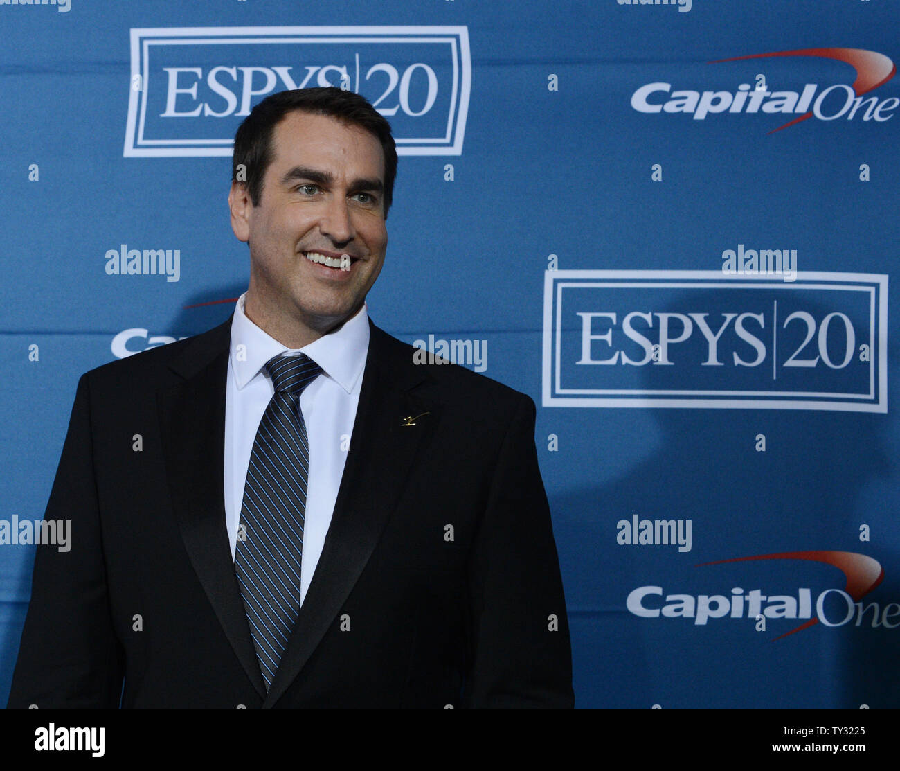 Host Bob Riggle appears backstage after being honored with the Jimmy V ...