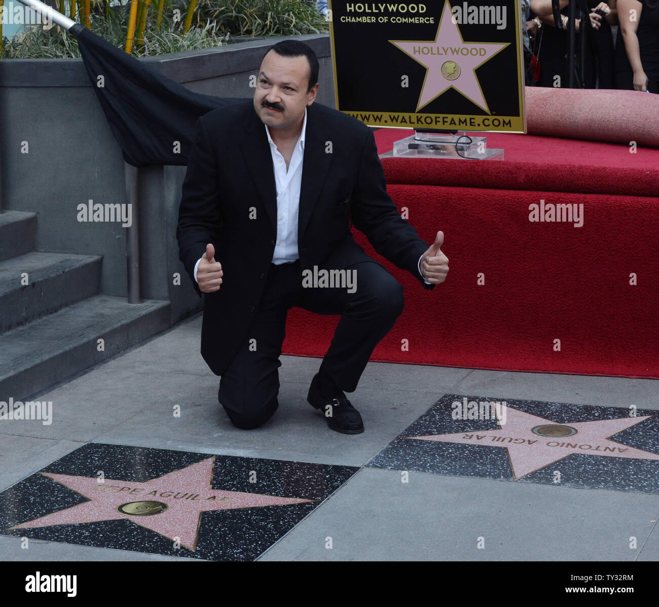 Latin singing star Pepe Aguilar of Mexico, poses between his father's ...