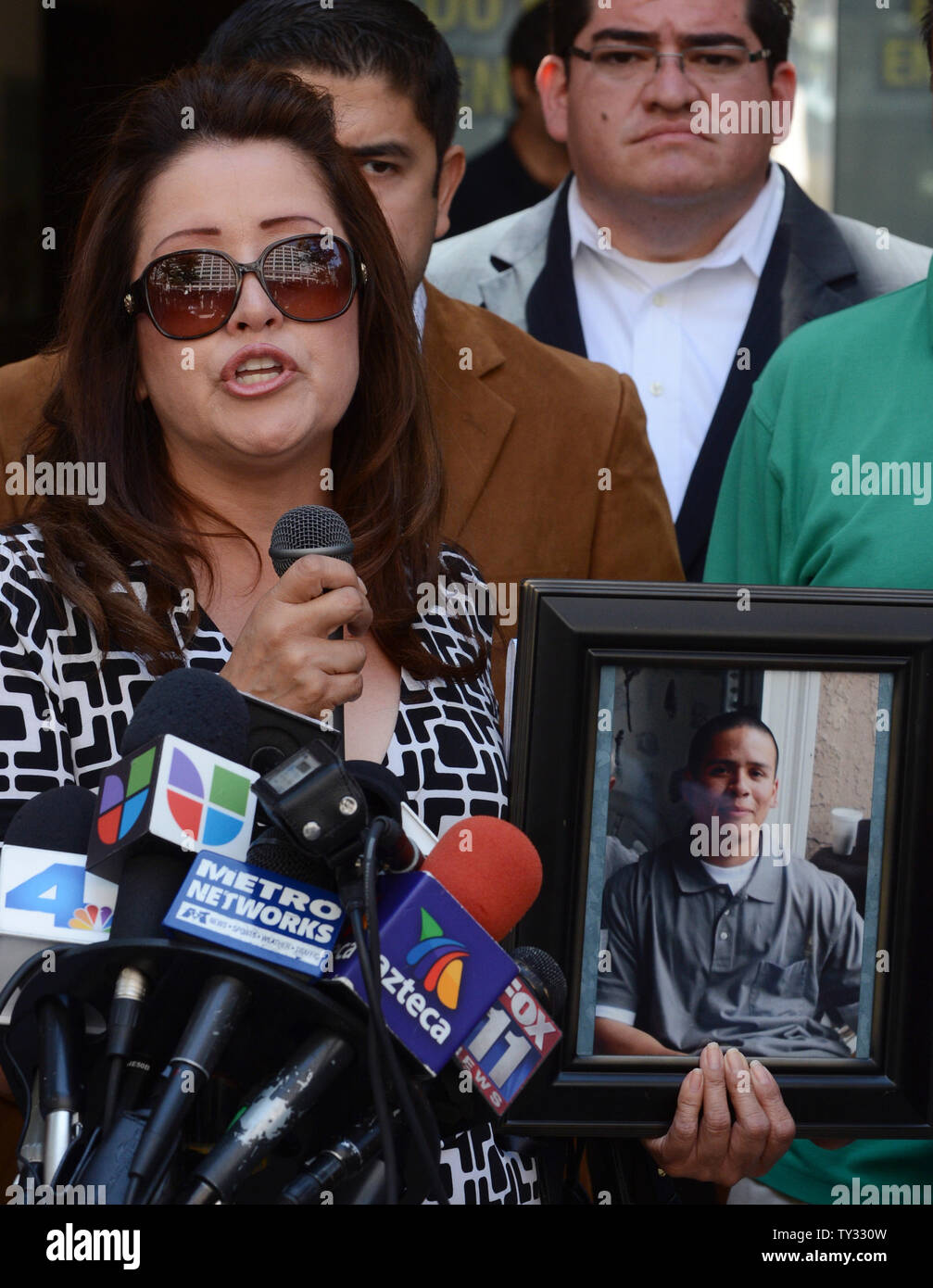 Barbara Padillaa holding a picture of her son Marcel Ceja, who died ...