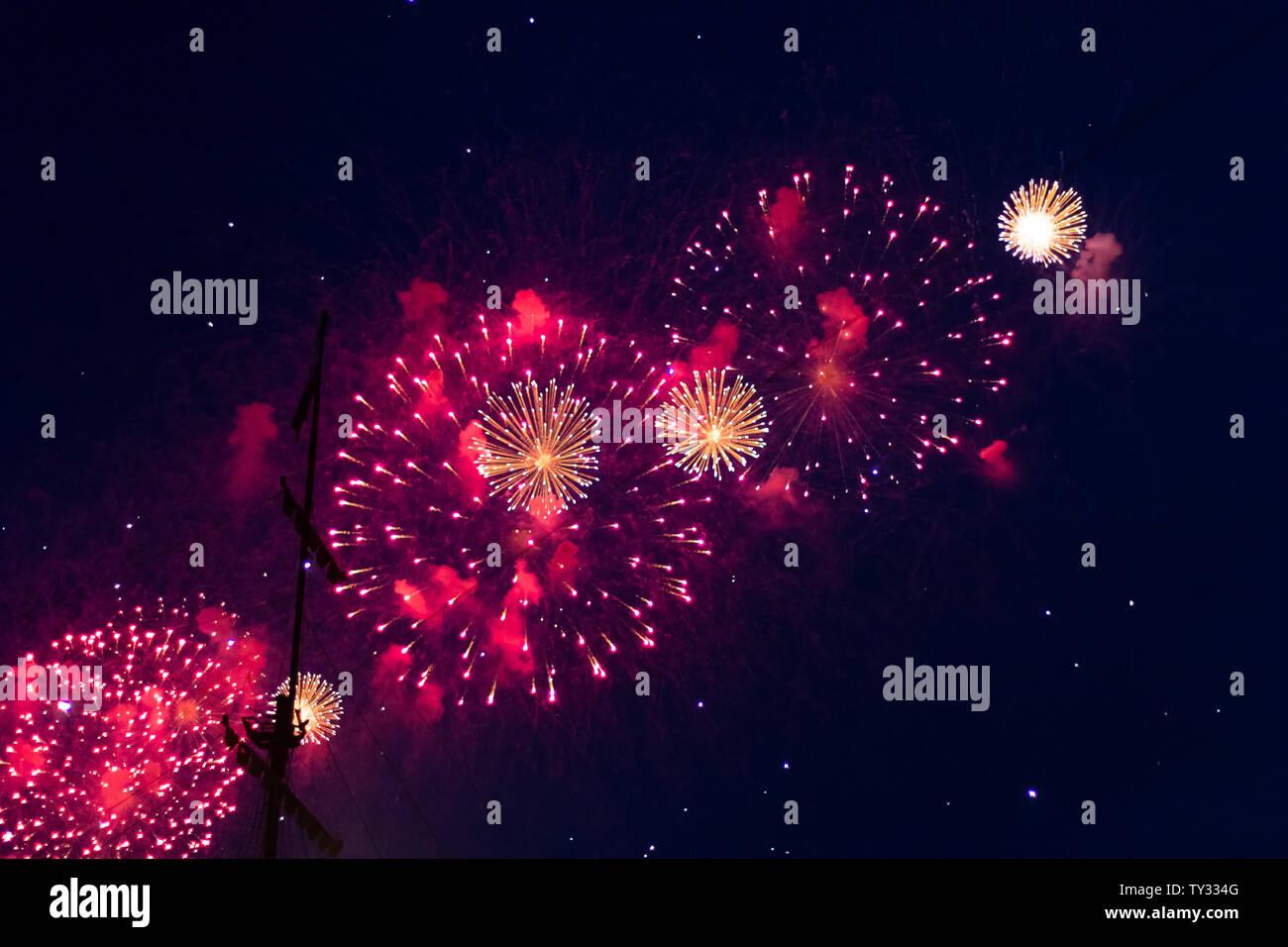 fireworks wallpaper four explosions festival Stock Photo - Alamy