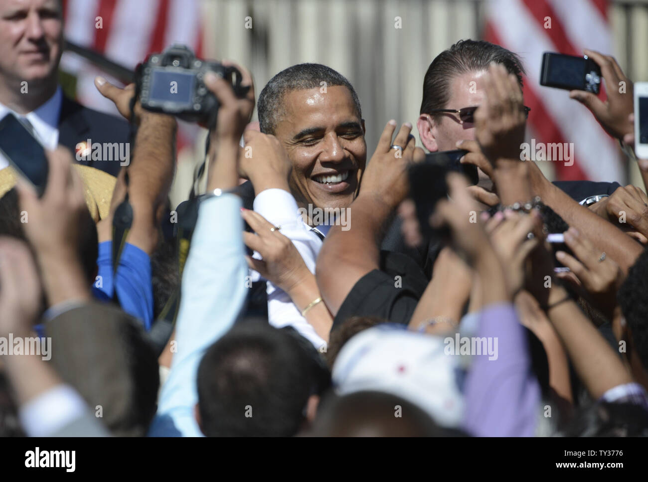 President Barack Obama shakes supporters hands after addressing a crowd ...