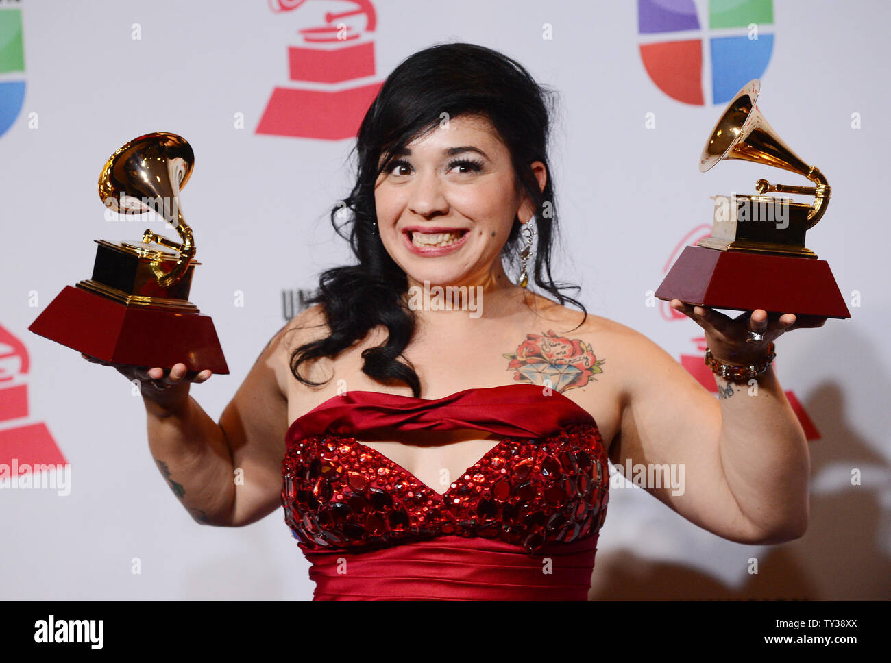 Singer Carla Morrison appears backstage with the awards she won for ...