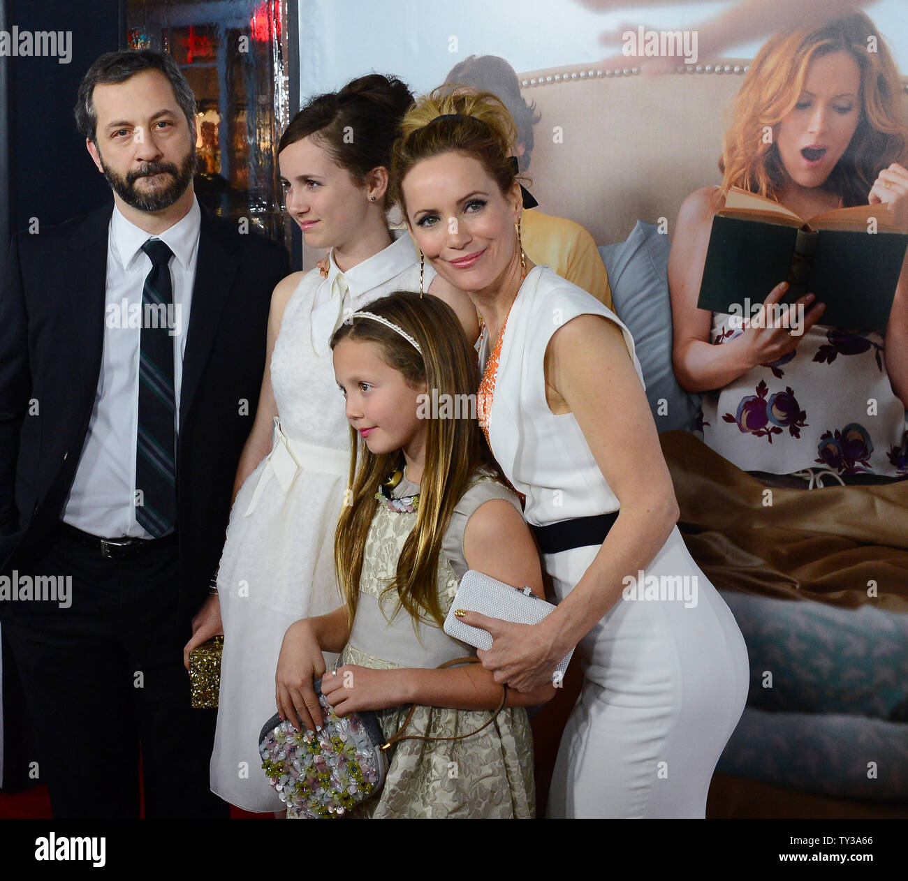 Director Judd Apatow poses with his daughters Maude Apatow and Iris Apatow and wife Leslie Mann ...