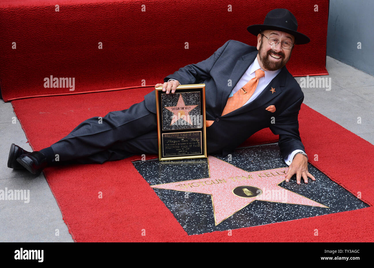 Local Los Angeles radio personality "Shotgun Tom" Kelly holds a replica ...