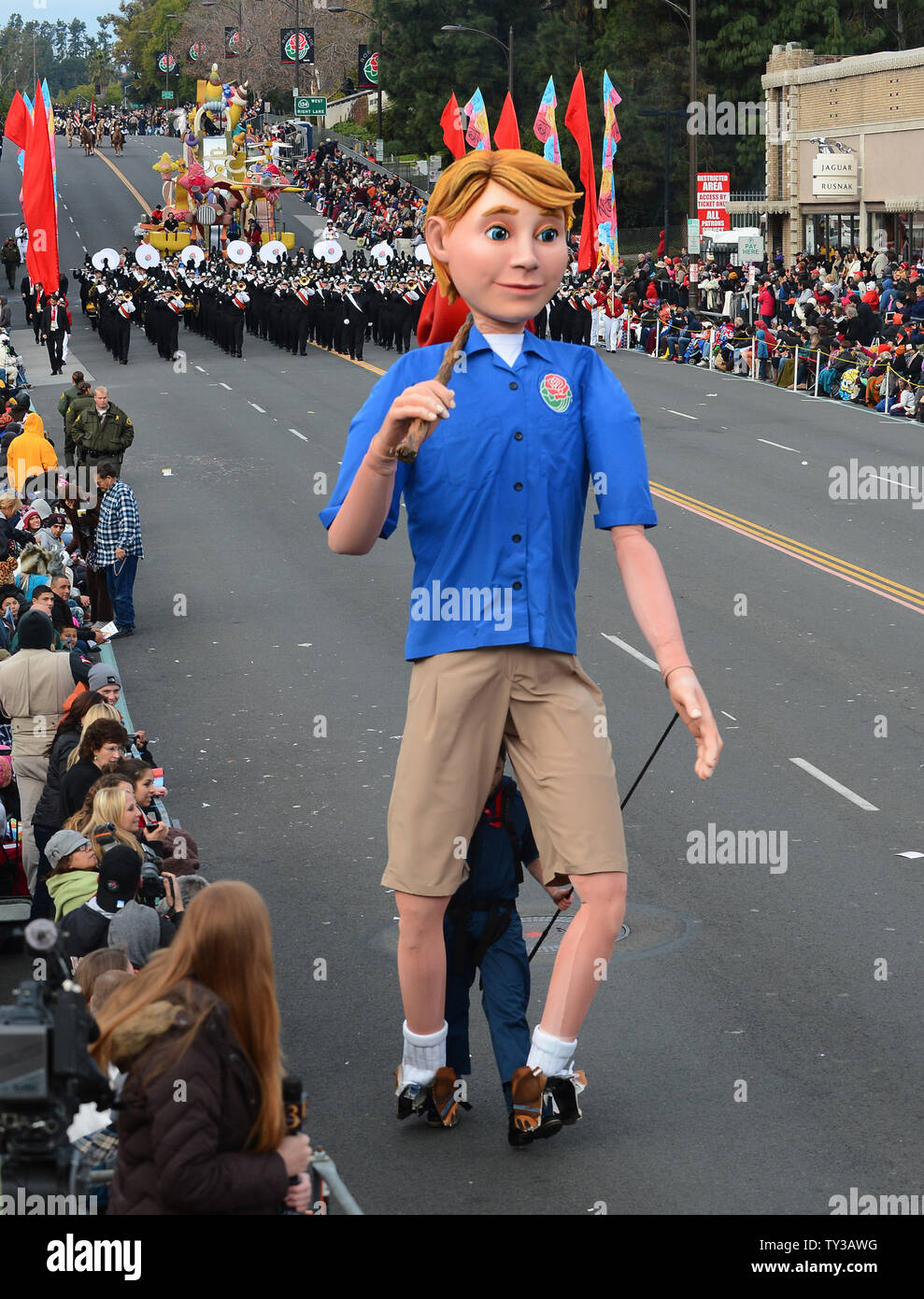 A giant puppet makes its way down the parade route in the 124th ...