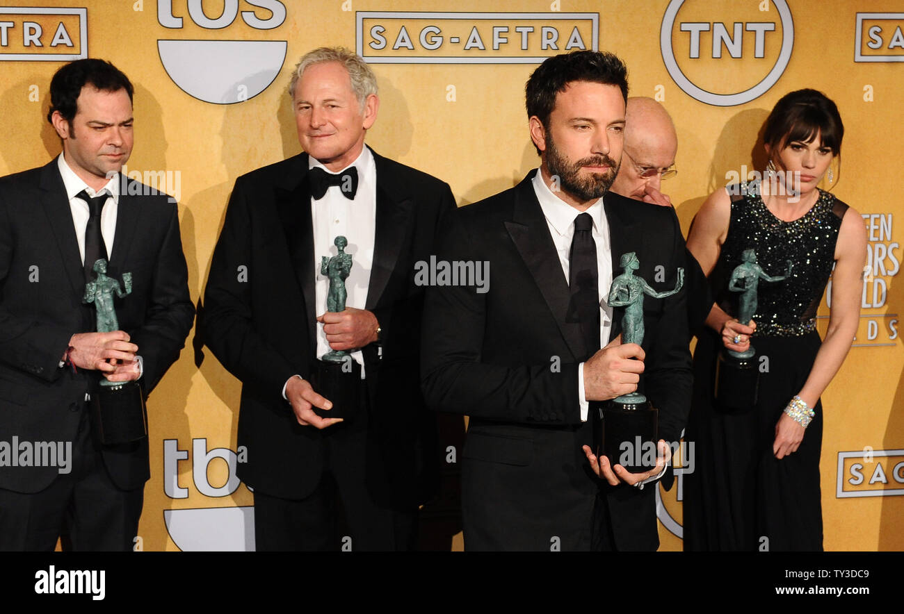 "Argo" director Ben Affleck (C) appears backstage with cast members ...