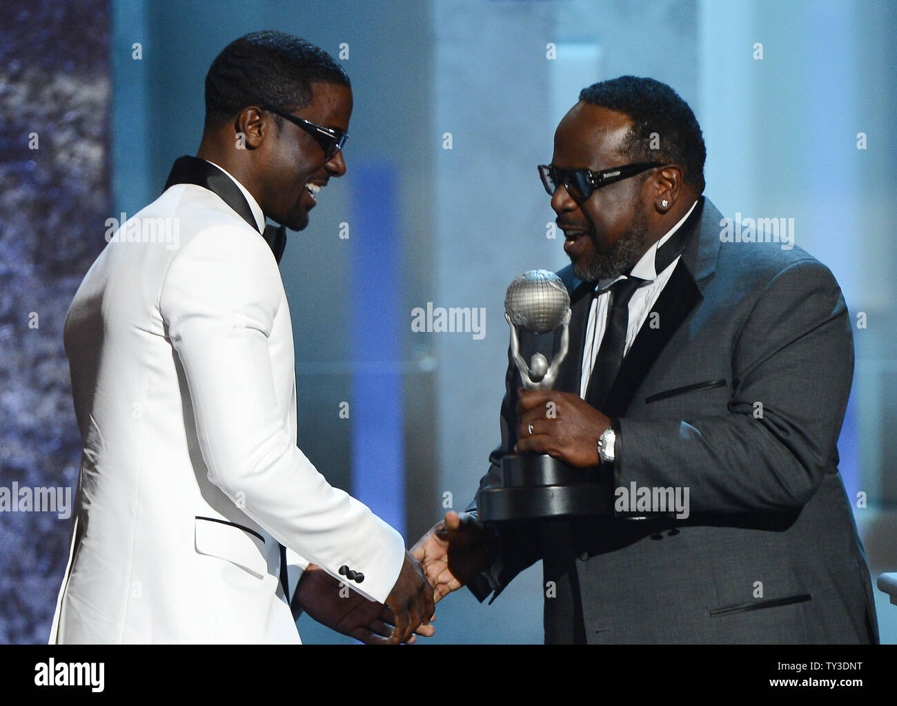 Actor Lance Gross (L) accepts the Outstanding Supporting Actor in a ...