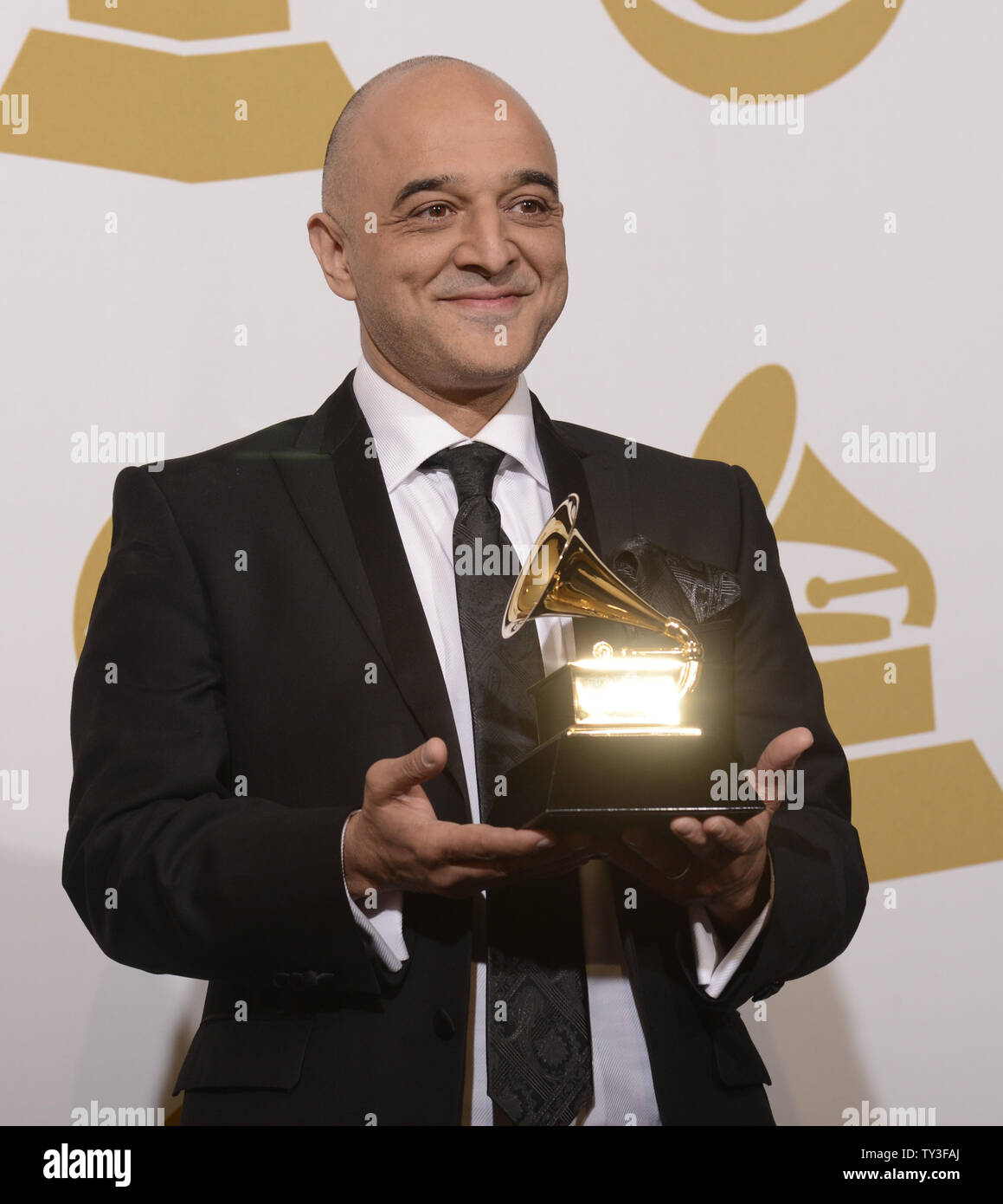 Omar Akram appears backstage with the Grammy he won for Best New Age ...