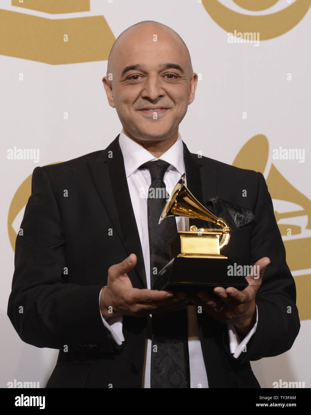 Omar Akram appears backstage with the Grammy he won for Best New Age ...