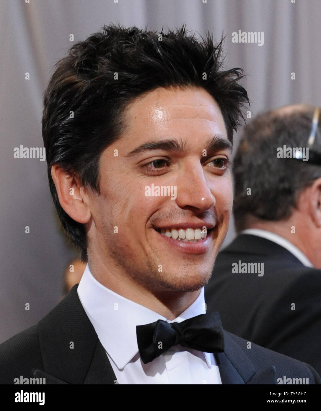 Actor Yan England arrives on the red carpet at the 85th Academy Awards ...