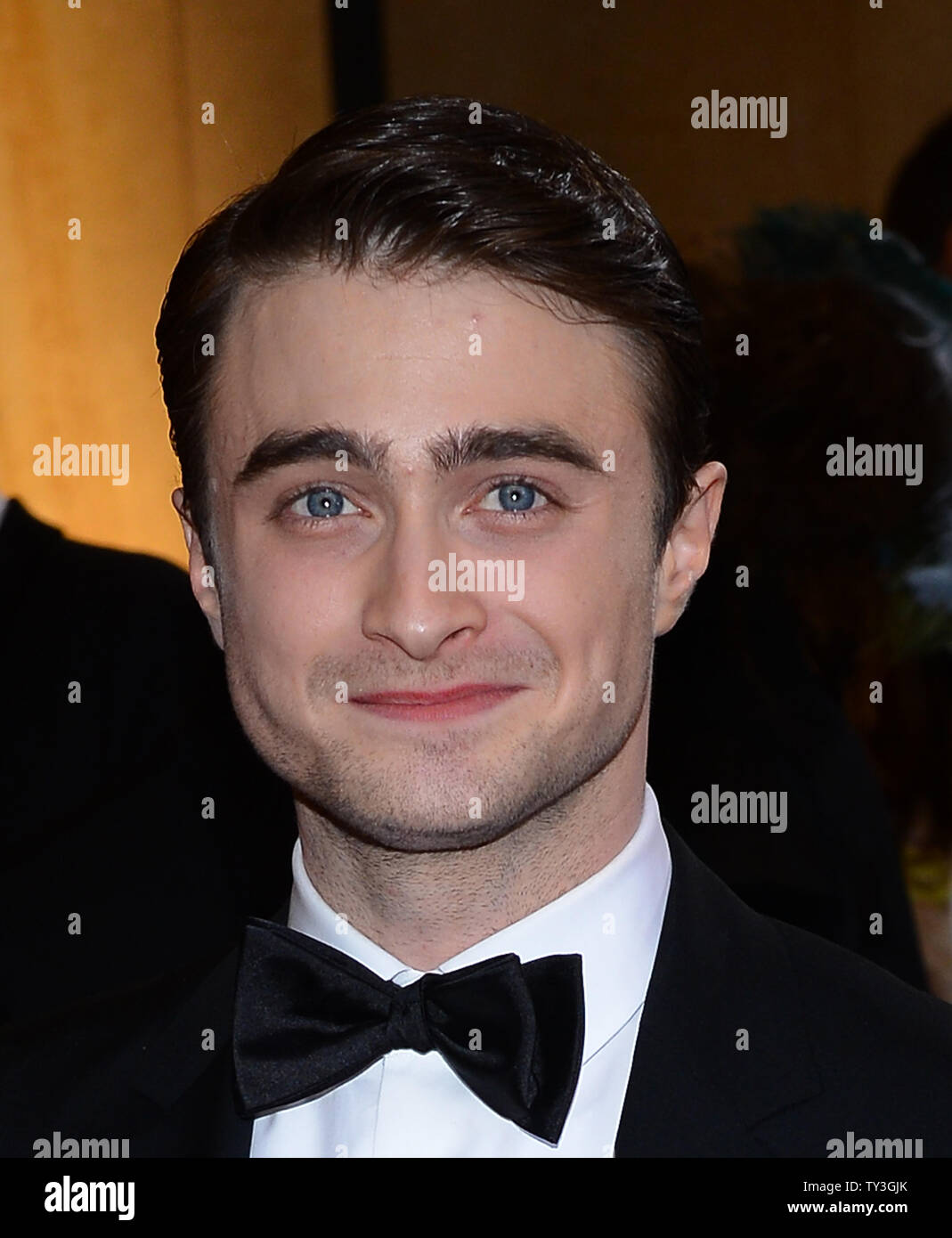 Actor Daniel Radcliffe arrives on the red carpet at the 85th Academy ...