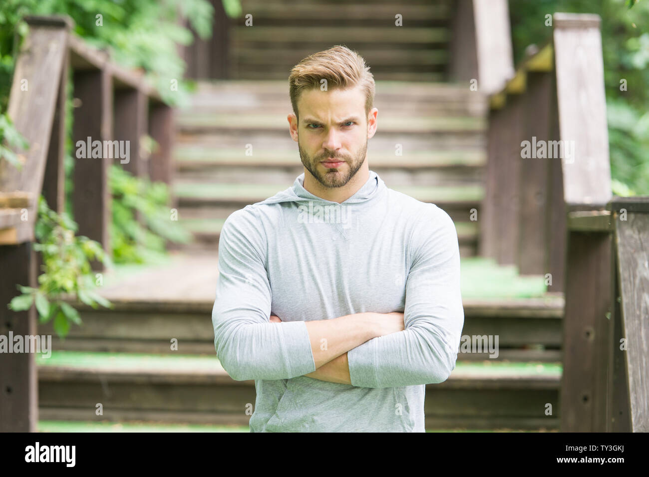 Overcome any obstacles. Sportsman lifestyle. Handsome athlete stairs ...