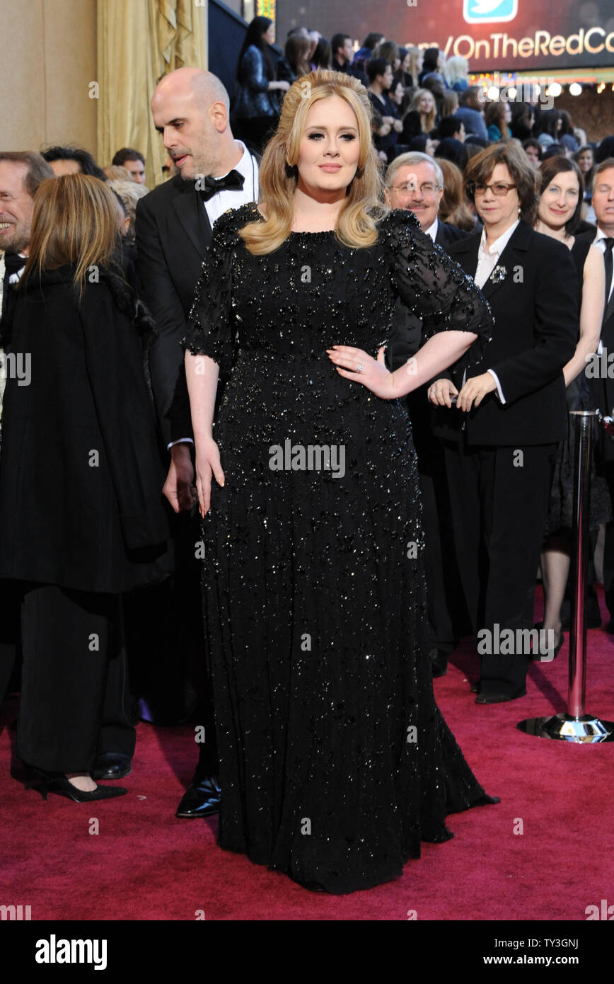 Singer Adele arrives on the red carpet at the 85th Academy Awards at ...