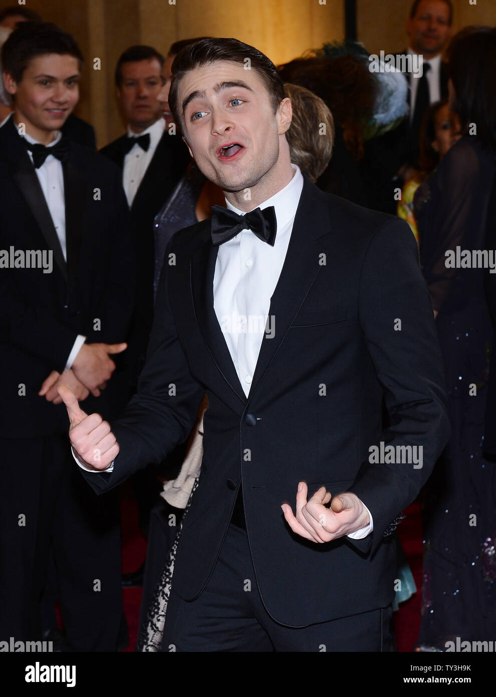 Actor Daniel Radcliffe arrives on the red carpet at the 85th Academy ...