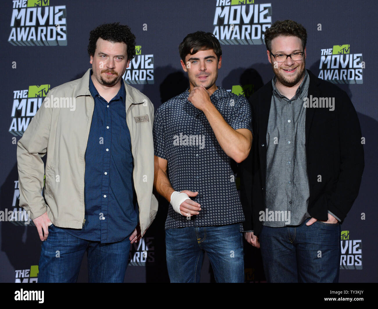 Actors Danny McBride, Zac Efron and Seth Rogen (L-R) appear backstage ...