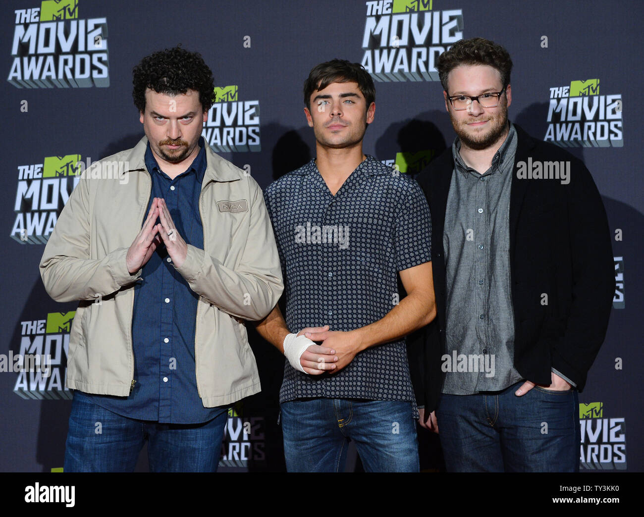Actors Danny McBride, Zac Efron and Seth Rogen (L-R) appear backstage ...