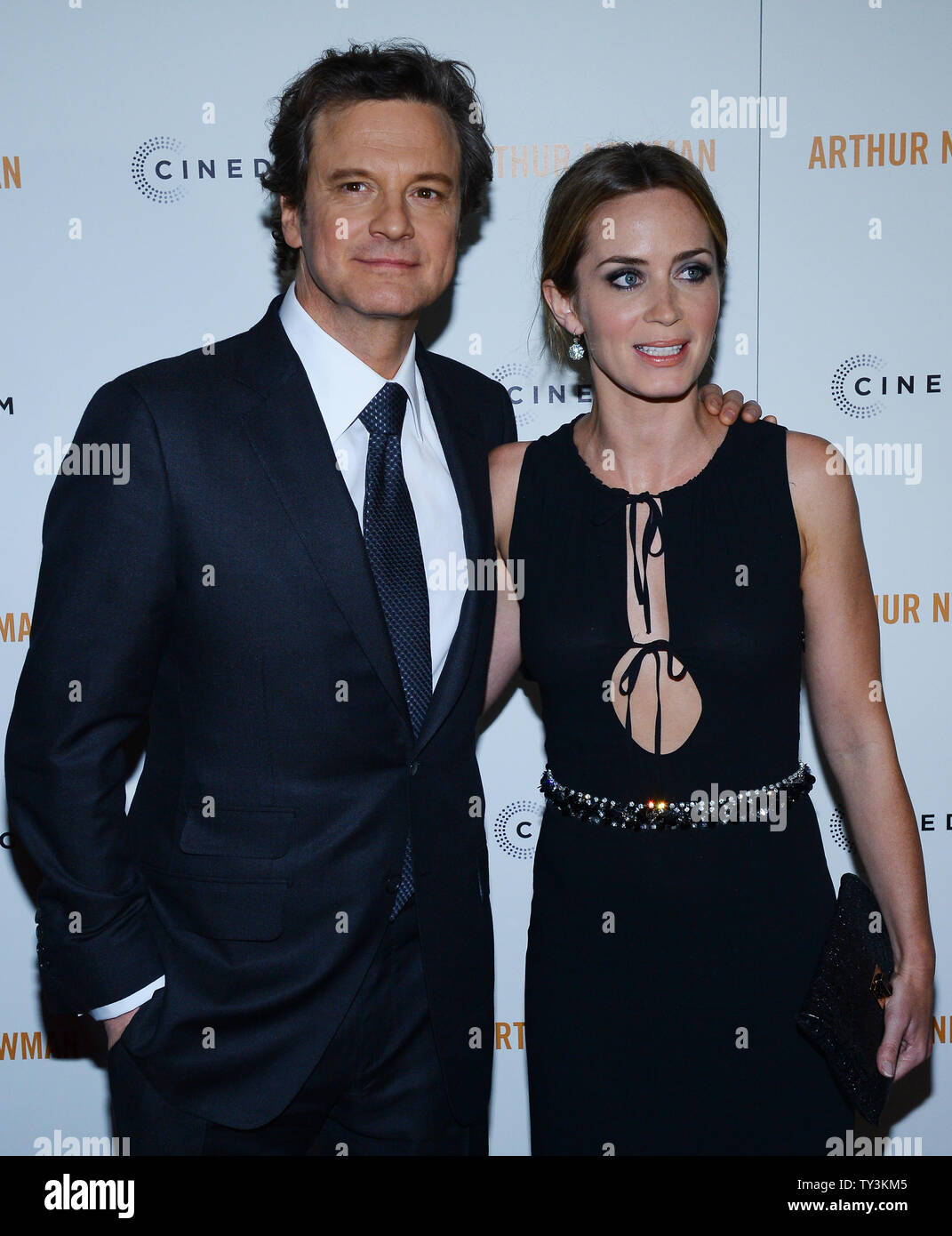 Cast members Colin Firth (L) and Emily Blunt pose as they attend the ...