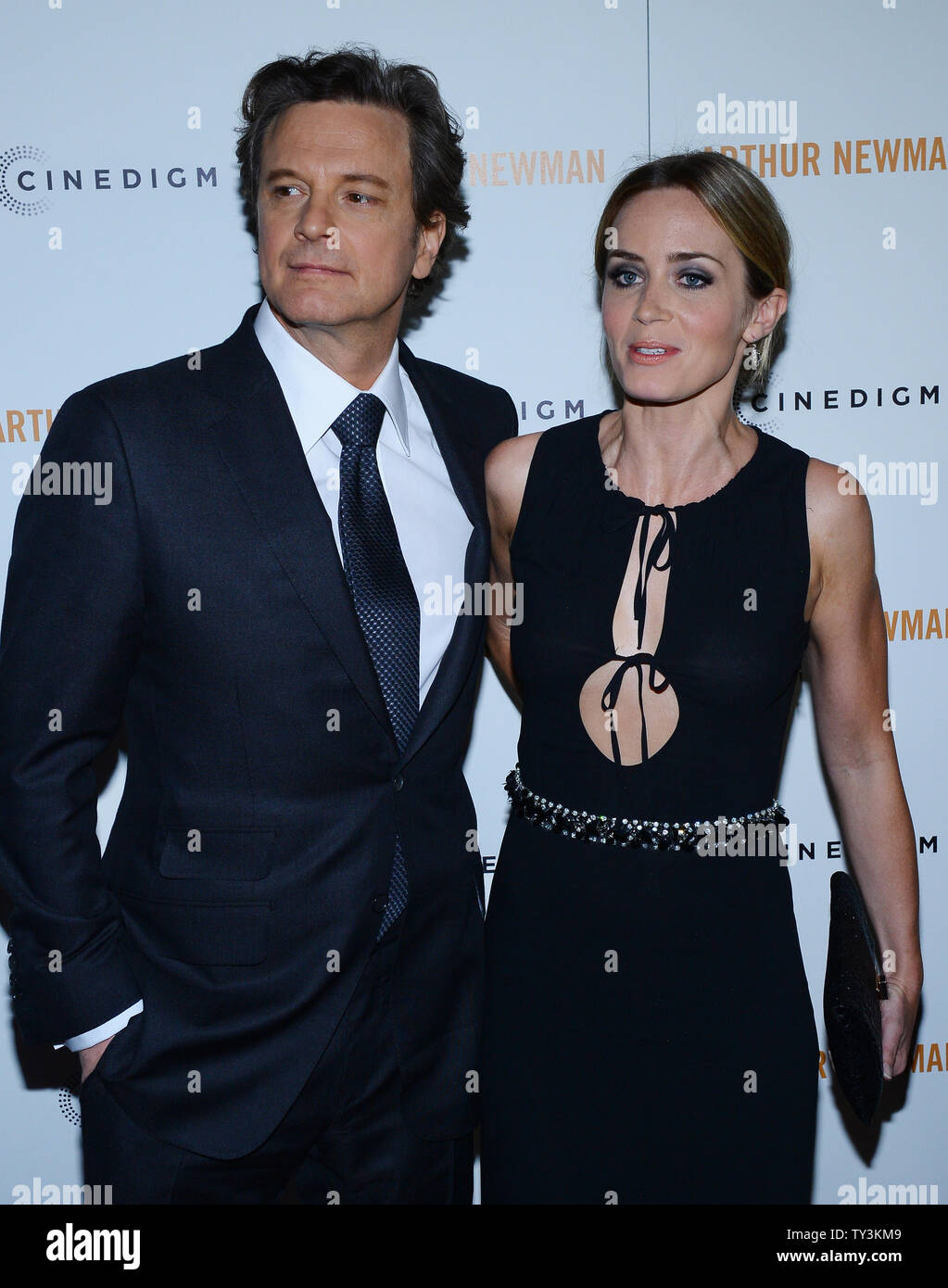 Cast members Colin Firth (L) and Emily Blunt pose as they attend the ...