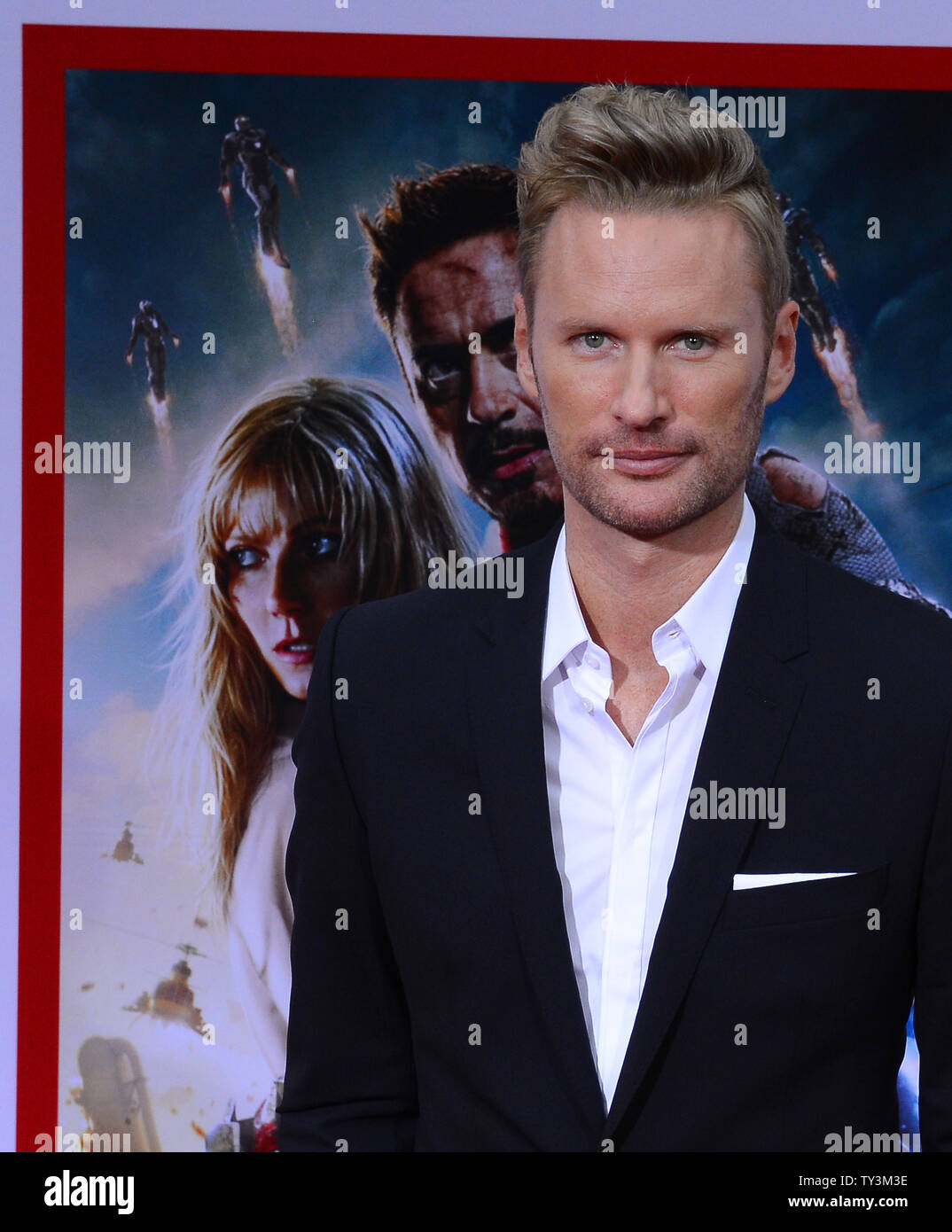 Composer Brian Tyler arrives for the "Iron Man 3" movie premiere at the ...