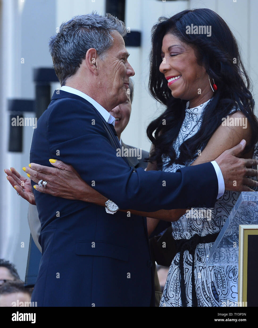 David Foster shares a moment with singer Natalie Cole, during an ...